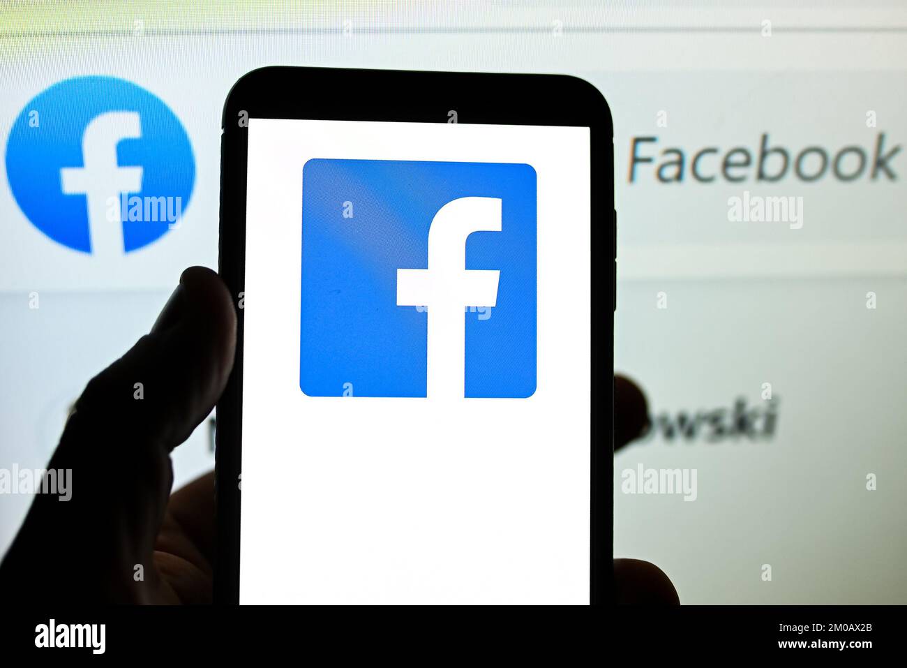 In this photo illustration a Facebook logo seen displayed on a ...