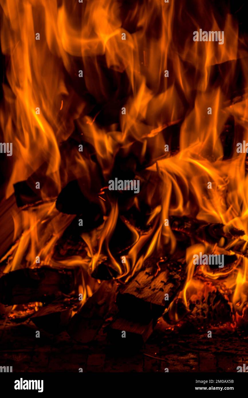 Wood burning in a bonfire. Great flames Stock Photo - Alamy