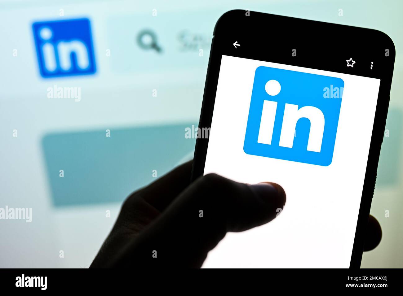In this photo illustration a Linkedin logo seen displayed on a ...