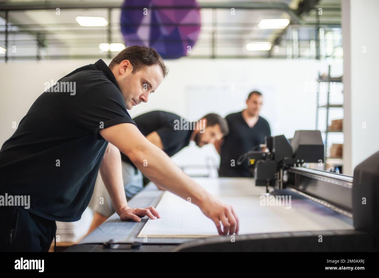 Professional workers graphic technicians operators work in a printing ... Professional workers graphic technicians operators work in a printing ...