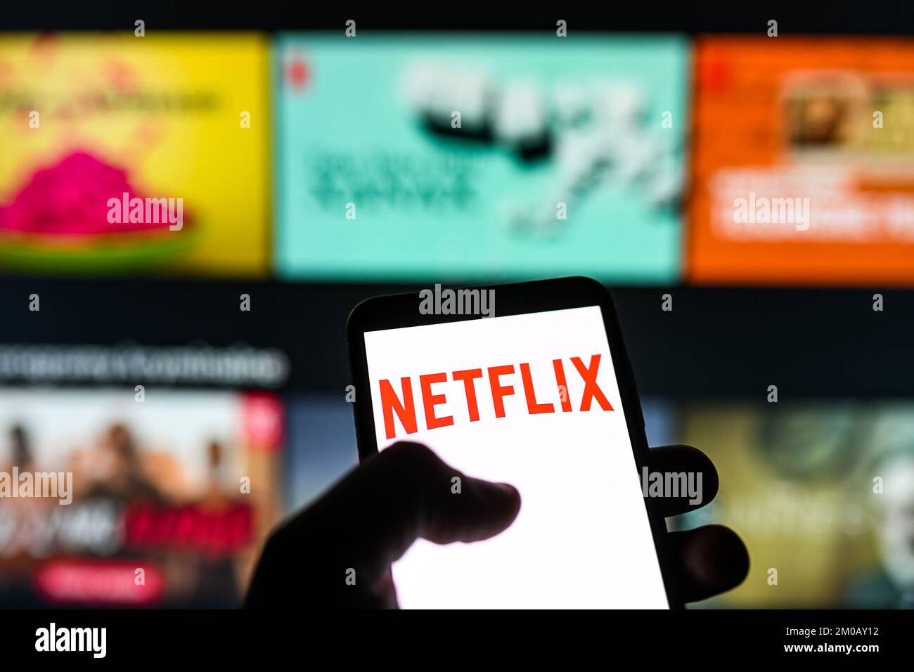 In this photo illustration a Netflix logo seen displayed on a smartphone. (Photo by Mateusz ...