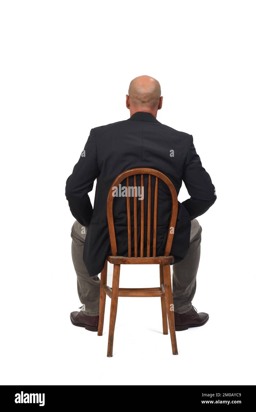 back view of a bald man sitting on chair on white background Stock ...