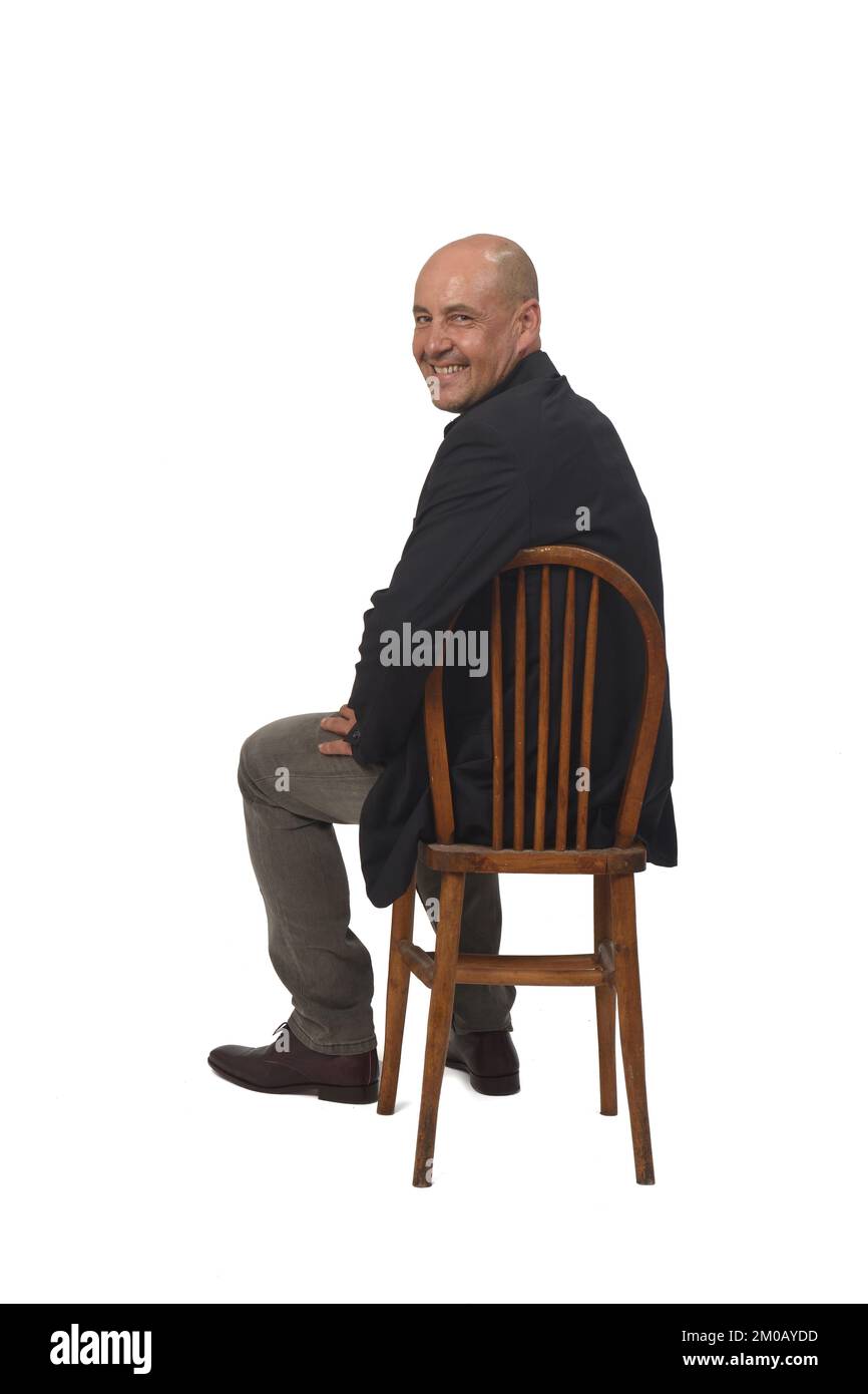 man sitting on chair and looking at camera on white background Stock ...