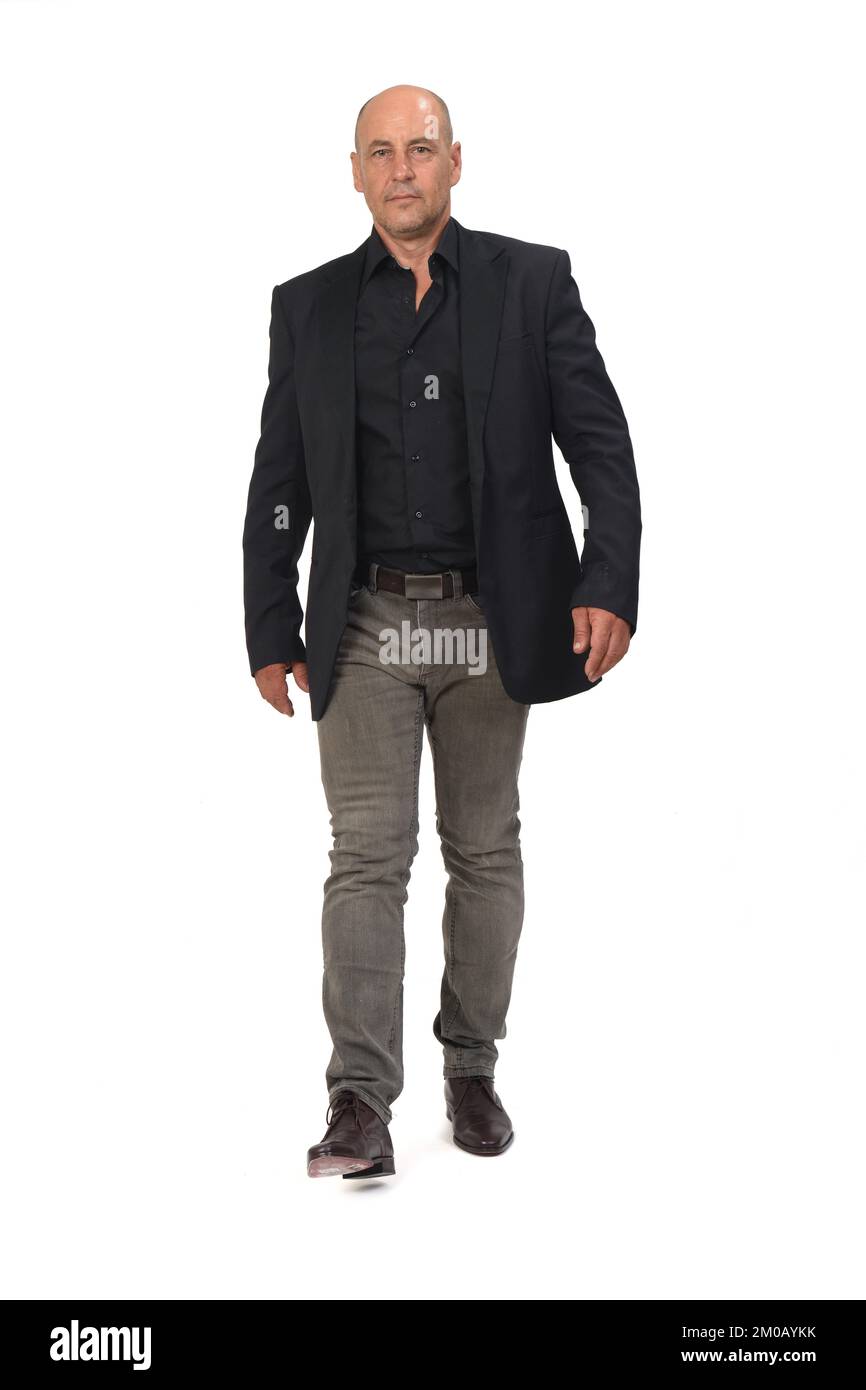 front view of serious man walking on white background Stock Photo - Alamy