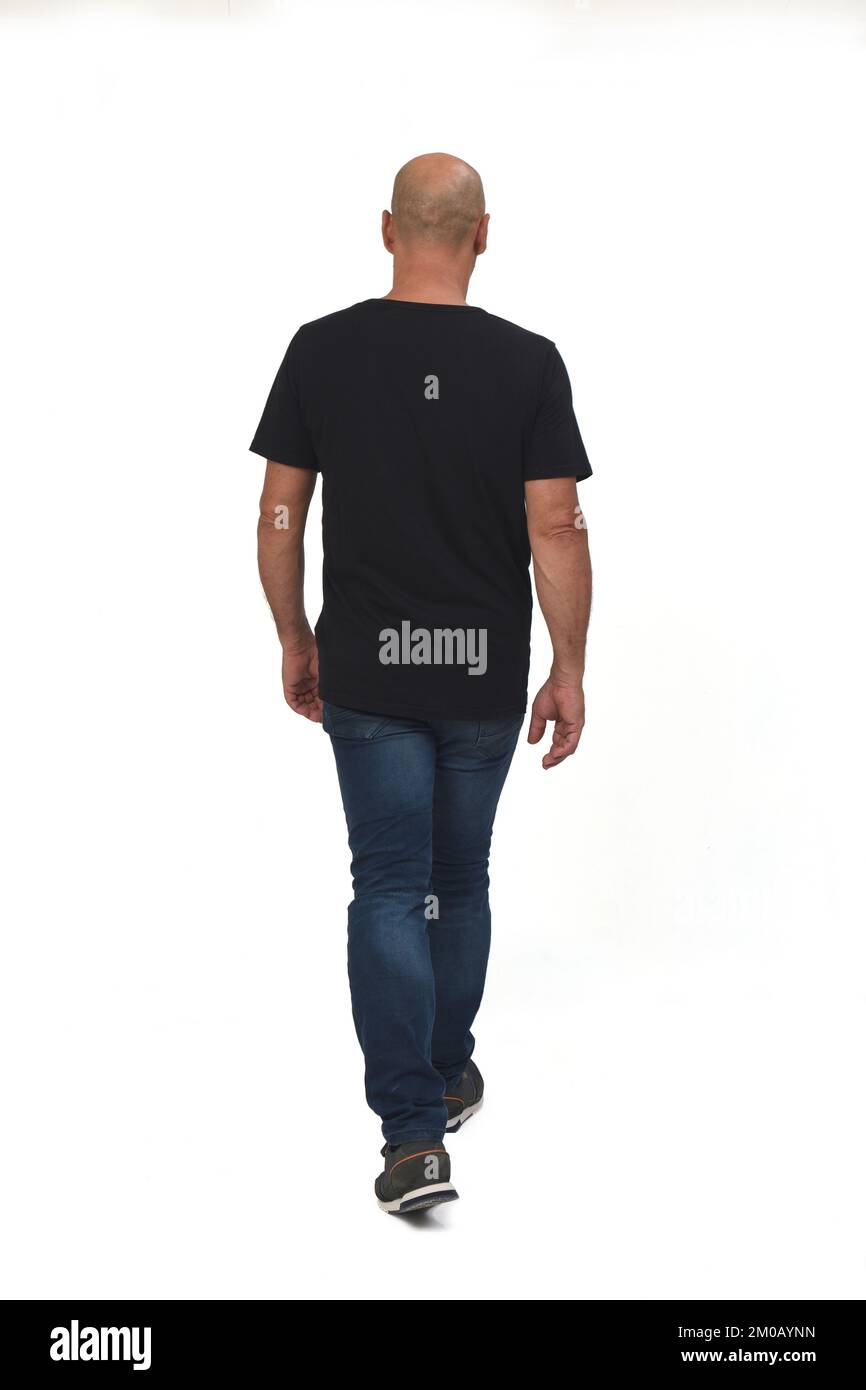 back view of a full portrait of a bald man walking on white background ...