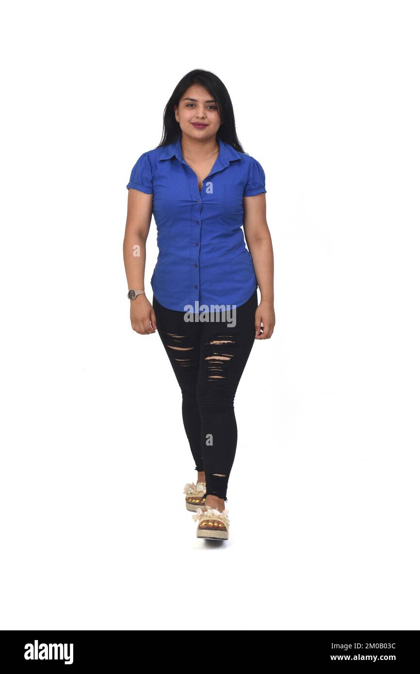 front view of a full portrait of a latin woman walking on white ...