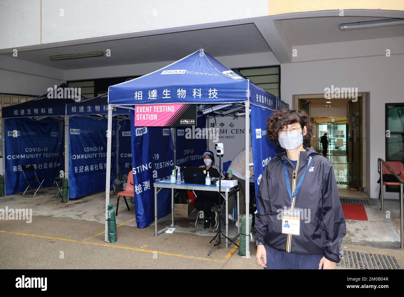 Emily Mak, Tournament Director, stands in front of the PCR testing ...