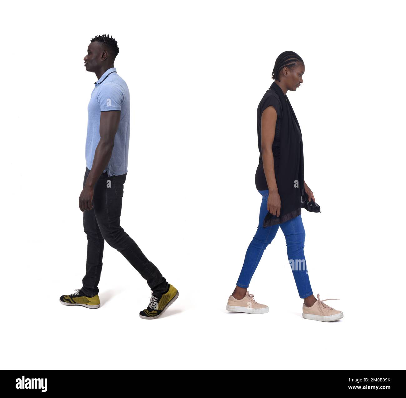 side view of a couple walking over white background Stock Photo - Alamy