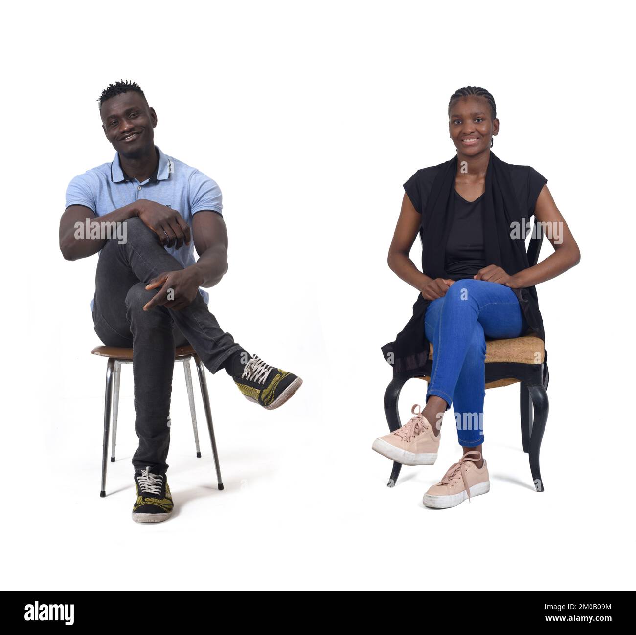 front view of a couple sitting on chair over white background Stock ...