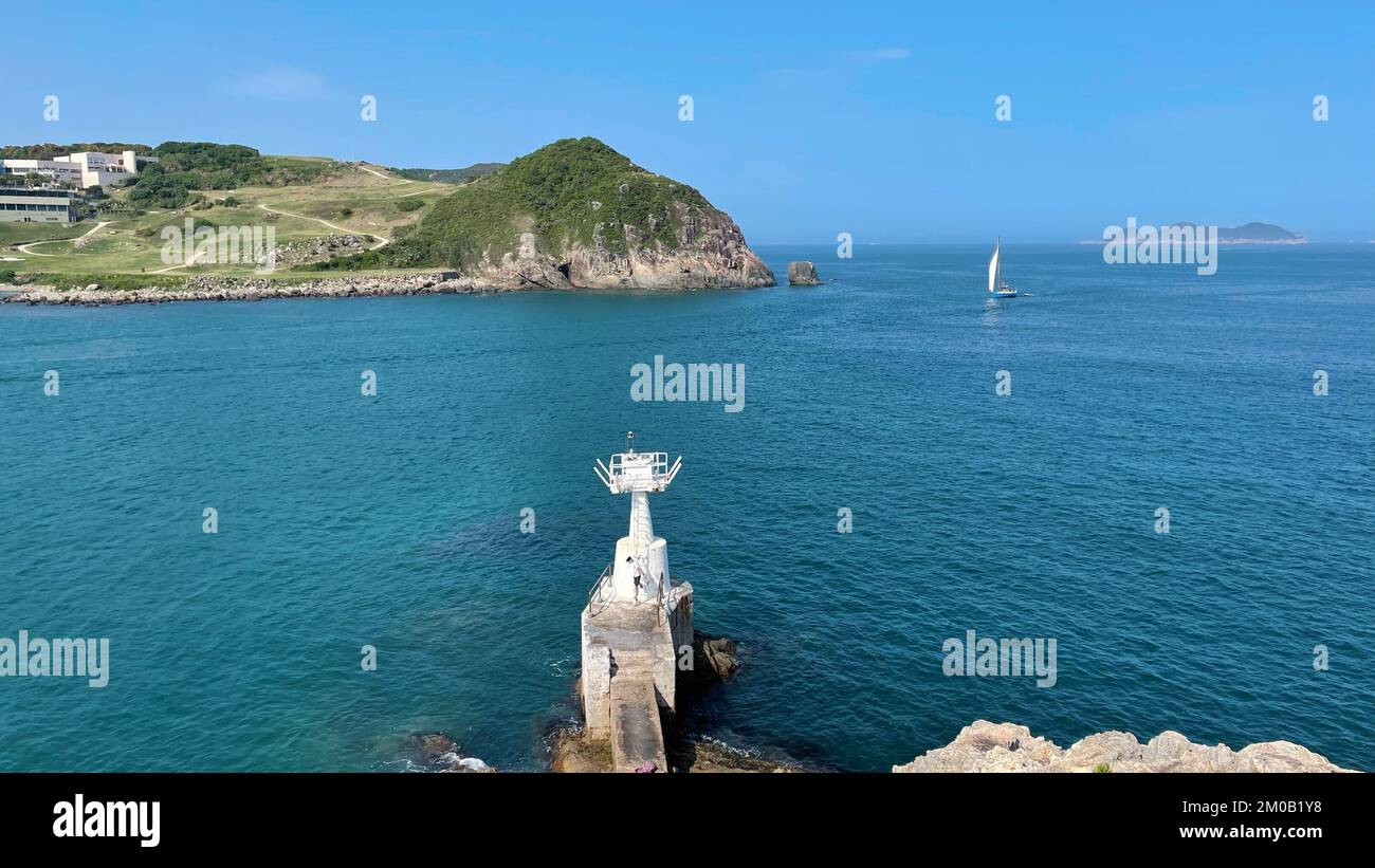 A beautiful seascape with a lighthouse at the shore Stock Photo - Alamy