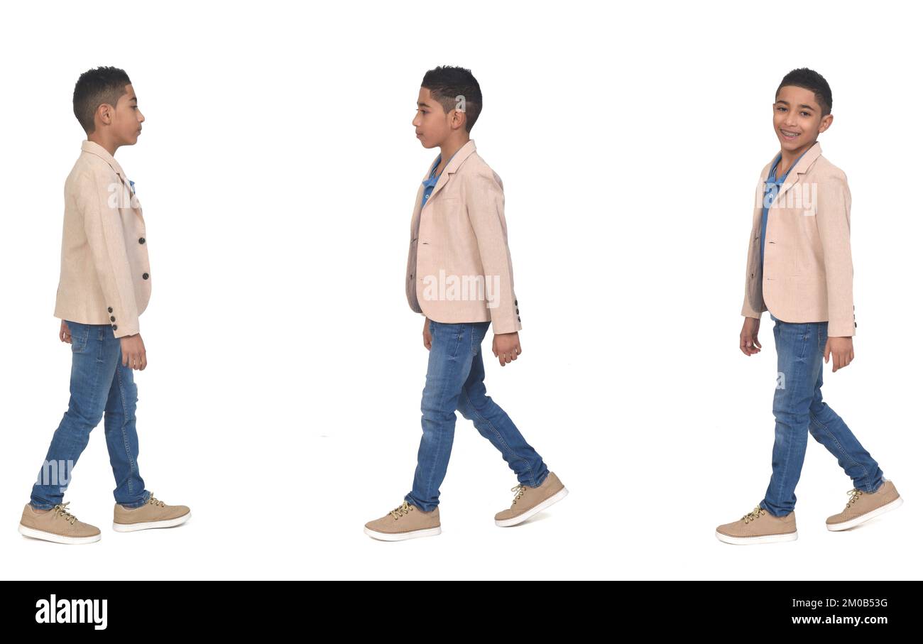 side view group of same boy with jeans and blazer walking on white ...