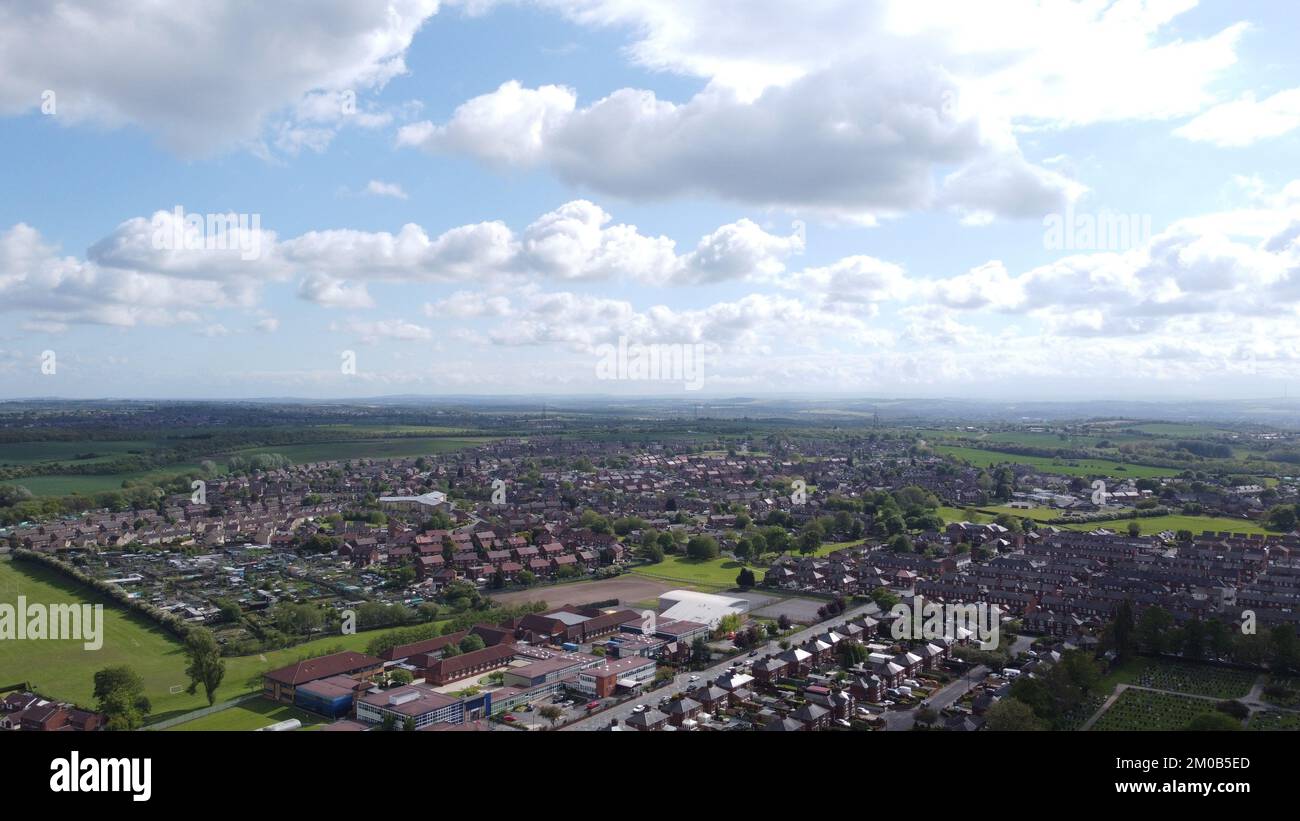 A beautiful view of a town with small houses under the blue cloudy sky ...