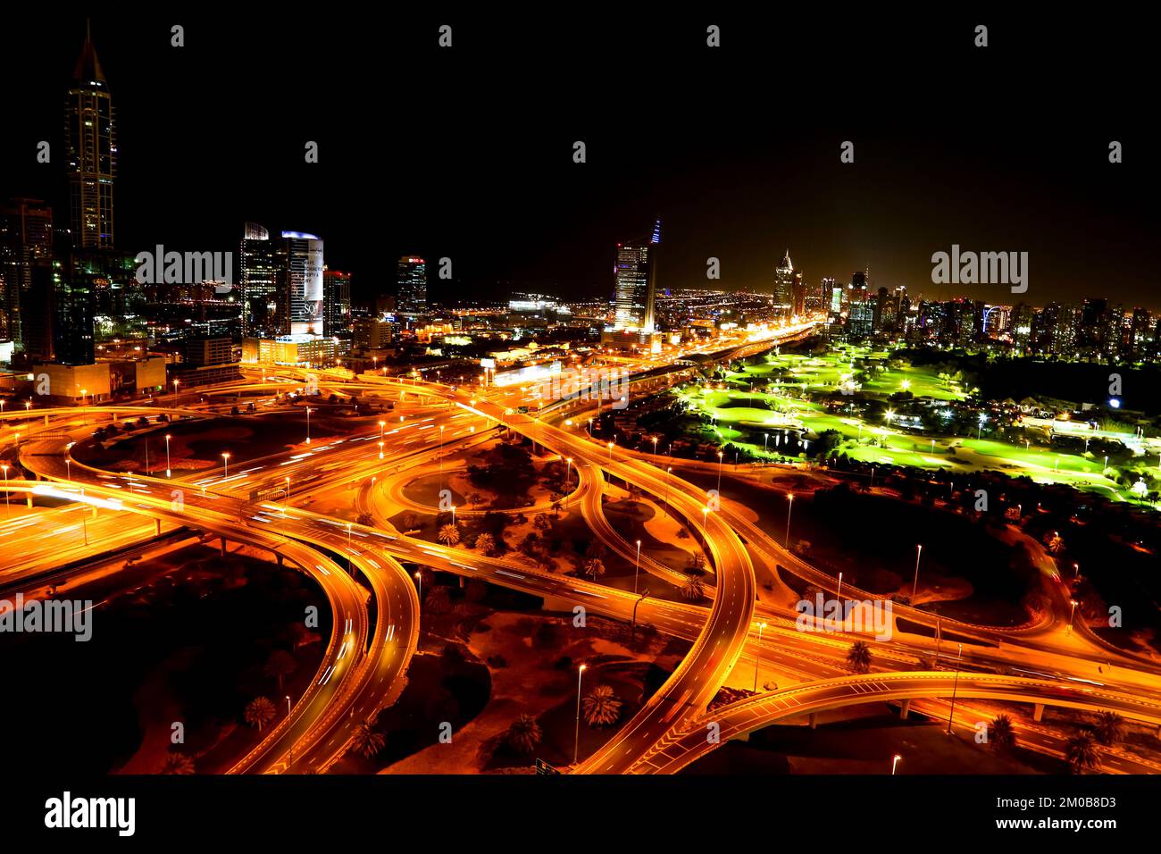 A beautiful night view of roads and modern buildings in a city with ...