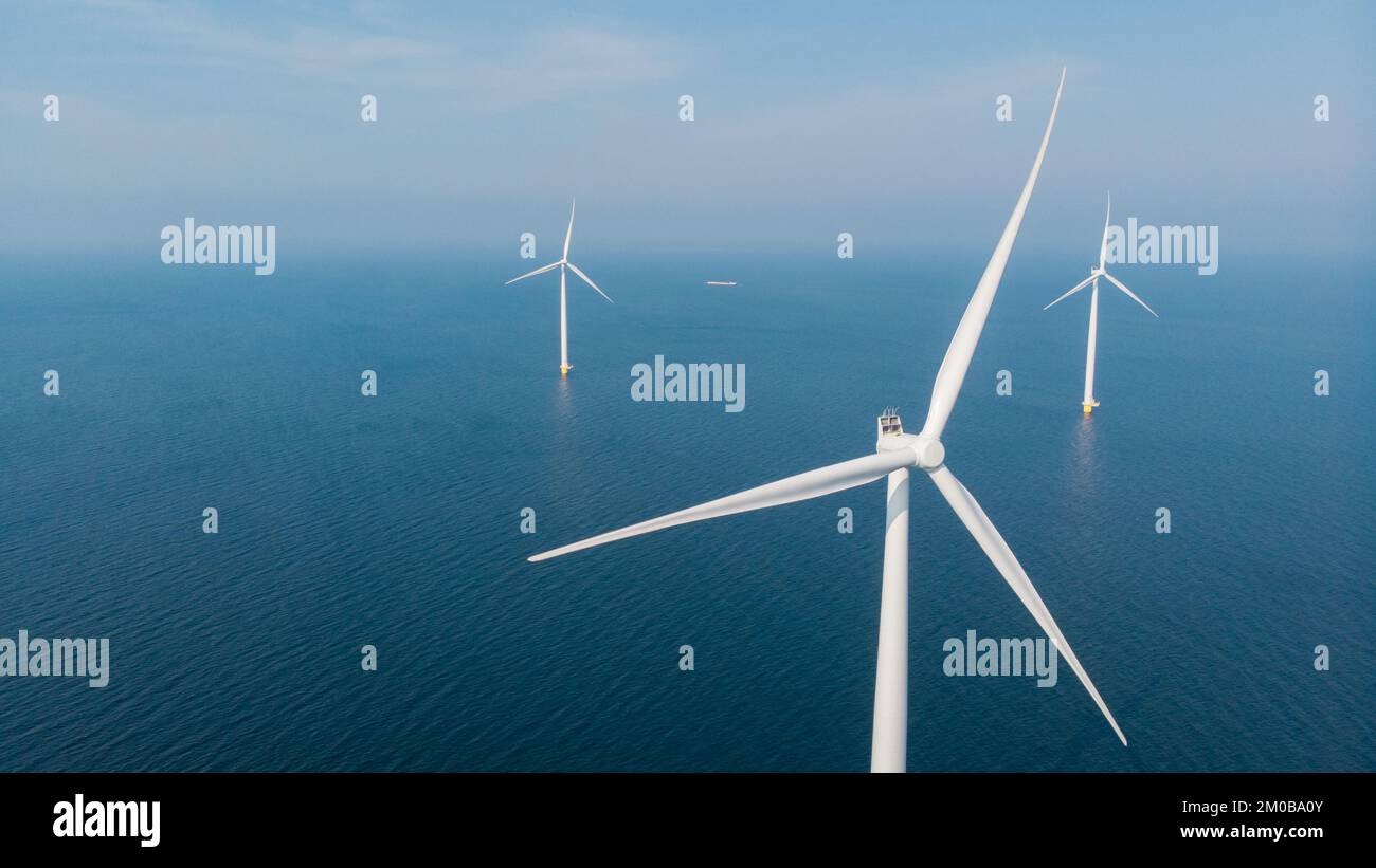 Windmill turbines at sea view from a drone aerial view from above at a ...