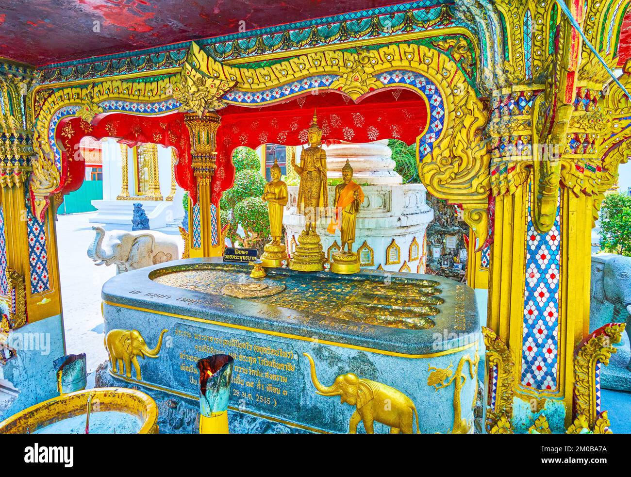 The small stone altar with Footprint of Buddha in Ubosot of Wat Chana ...