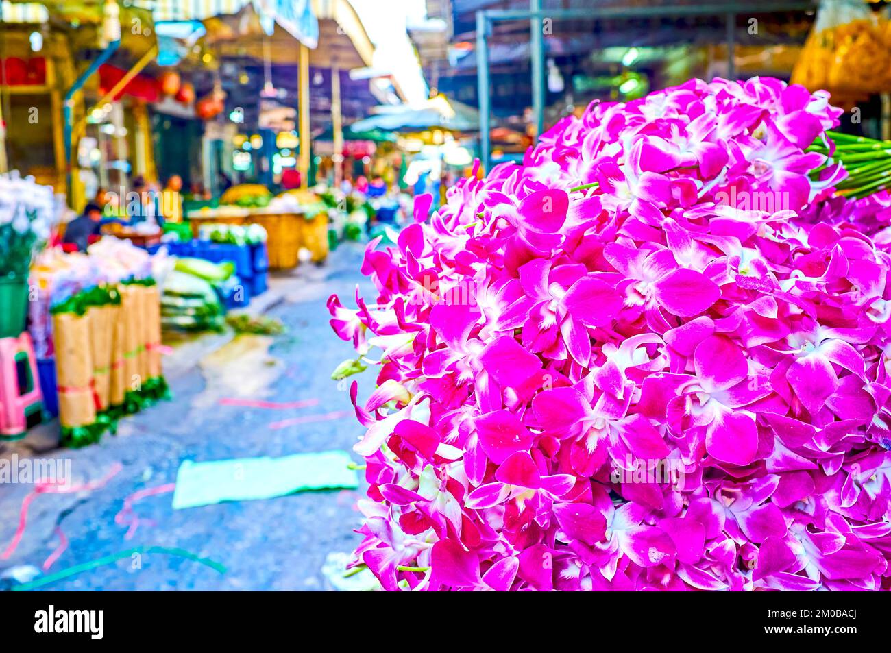 The alley in Flower Market Pak Khlong Talat with heap of rose orchids ...
