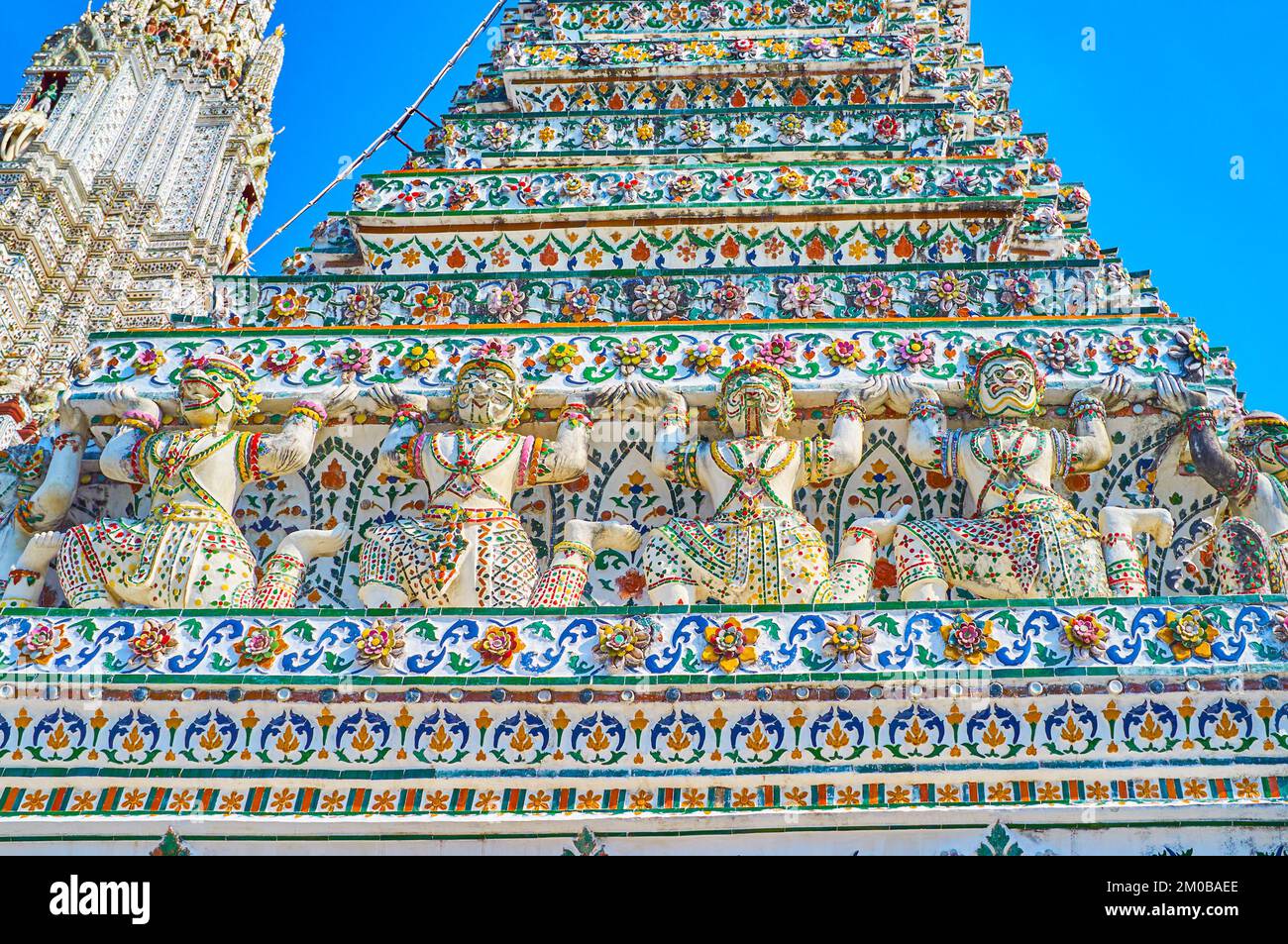 Yaksha tile covered sculptures on Wat Arun prang, Bangkok, Thailand ...