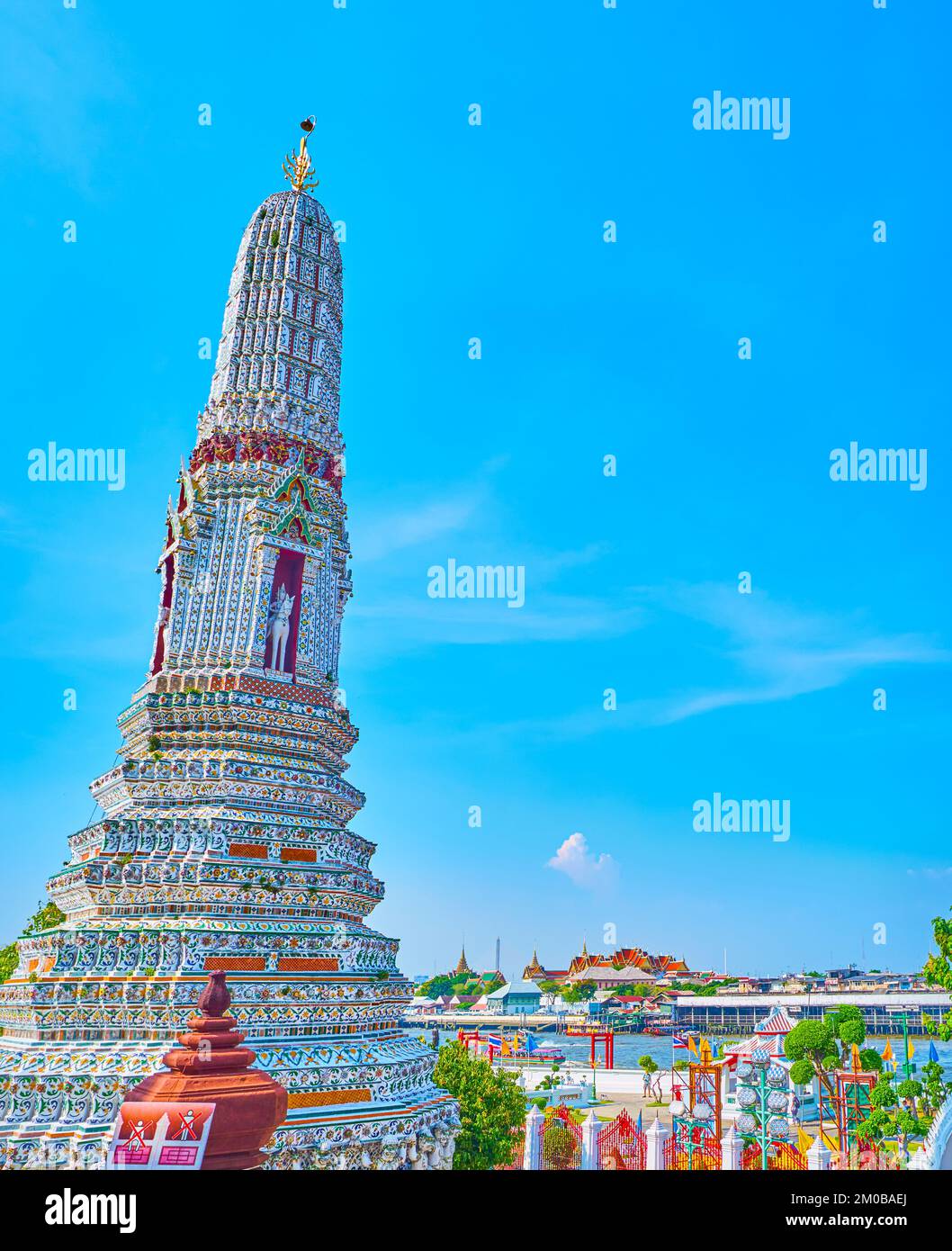 The white corner Prang of Wat Arun complex and Grand Palace of Bangkok ...