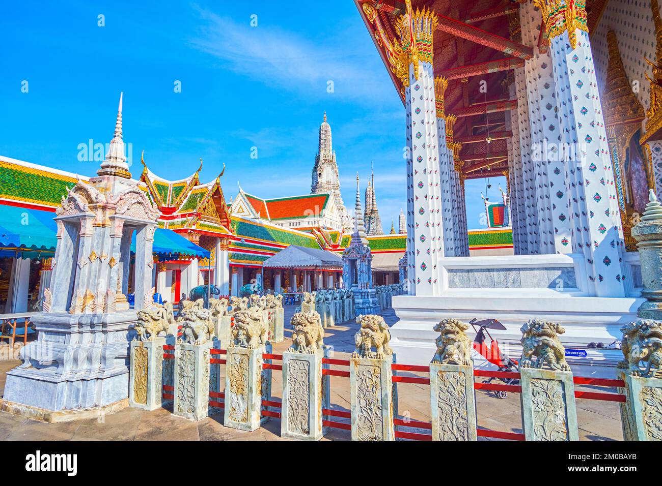 The courtyard of Ubosot shrine in Wat Arun temple with line of stone ...