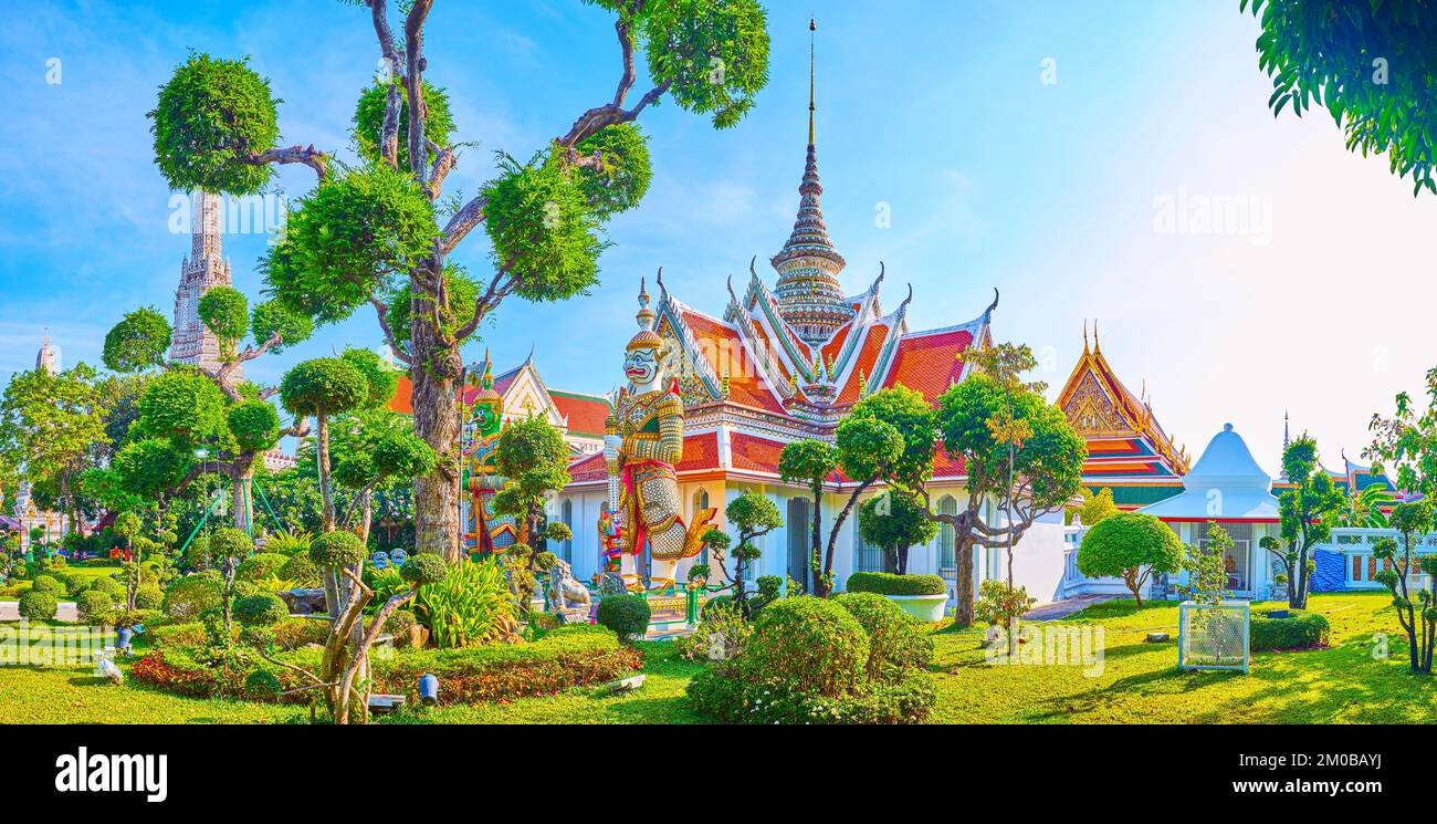 Panorama of the ornamental garden and the entrance gate with statues of ...