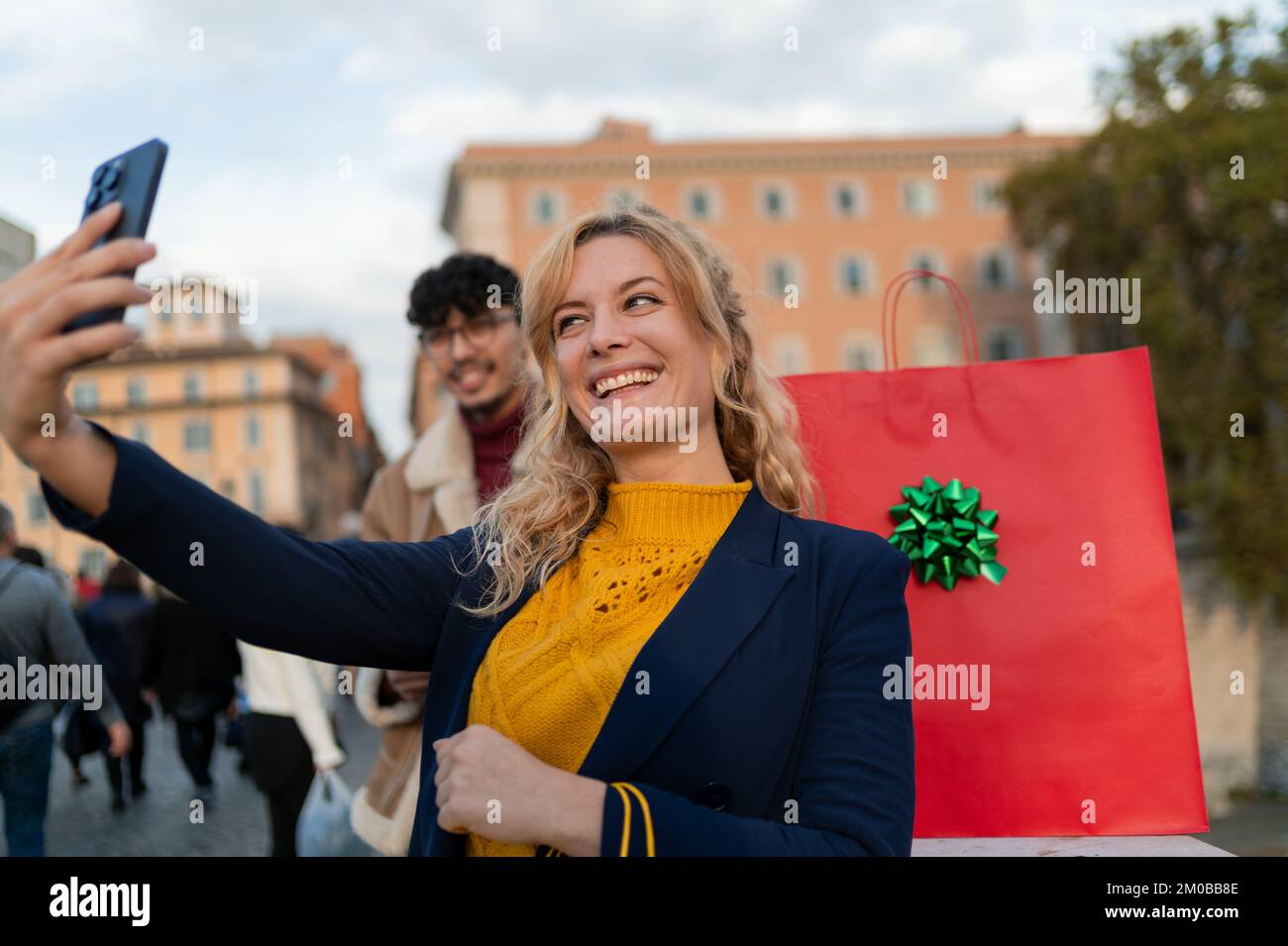 selective focus on Blonde woman making a selfie with smartphone after ...