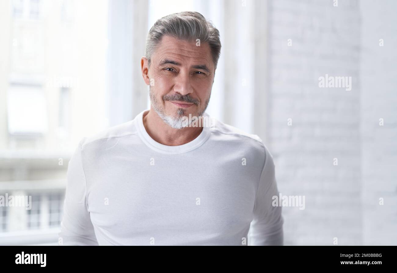 Portrait of mature age, middle age, mid adult casual man at home, happy ...