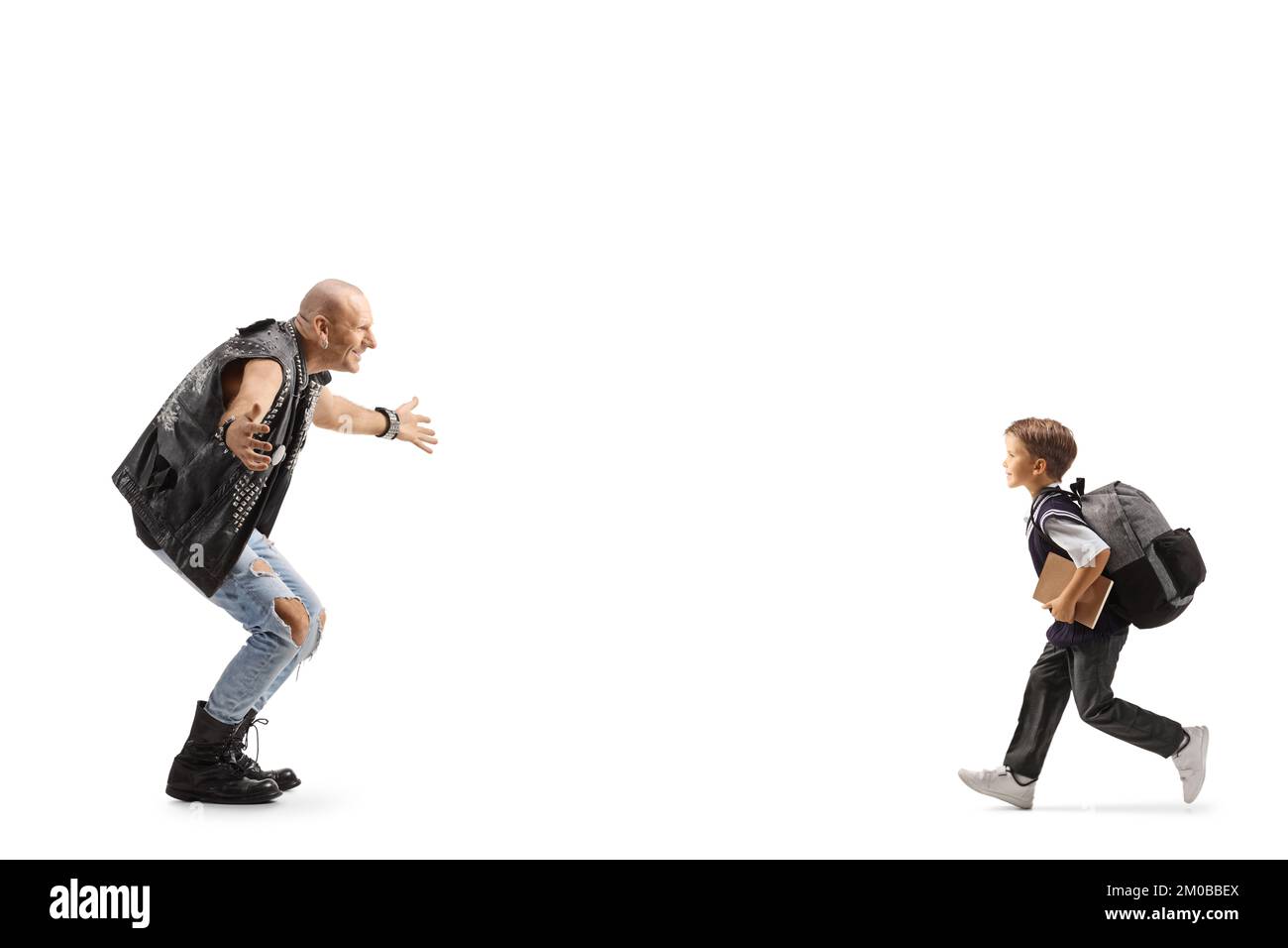 Full length profile shot of a schoolboy running to hug a rock music ...