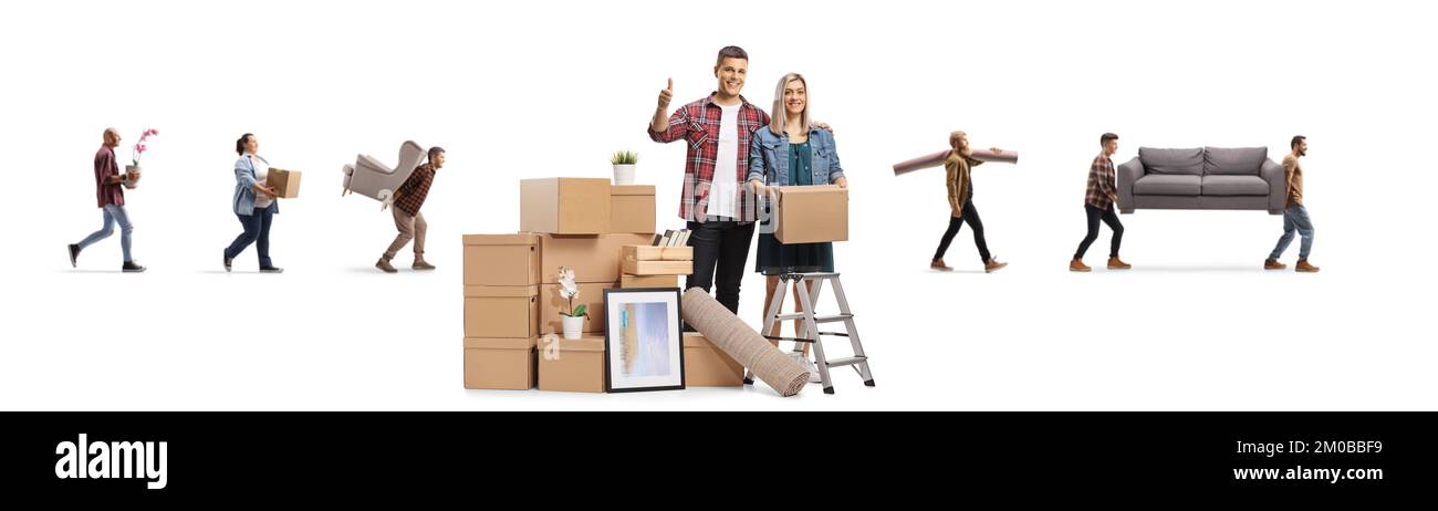 Happy young couple with removal boxes and people carrying items behind ...