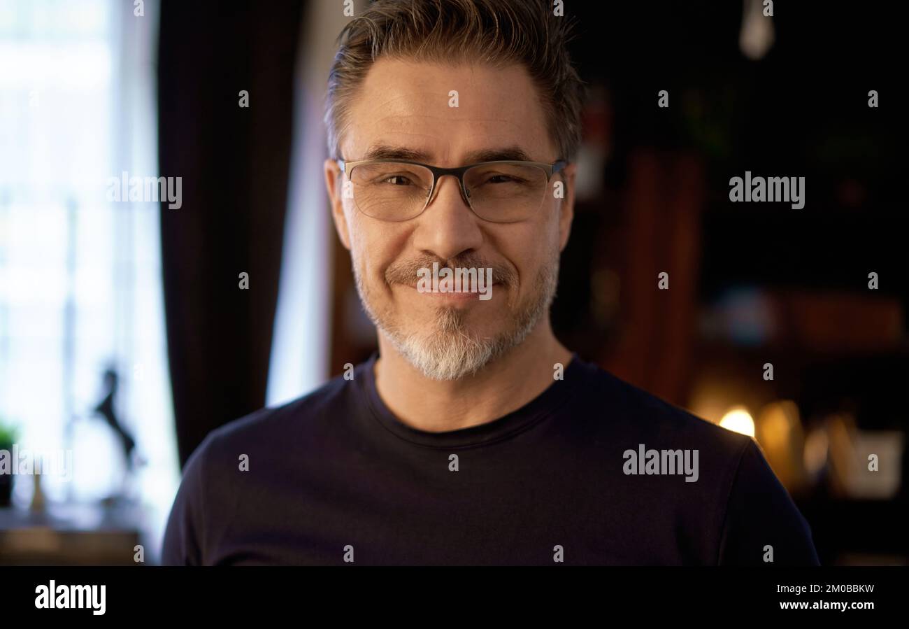 Portrait of mature age, middle age, mid adult casual man in glasses ...