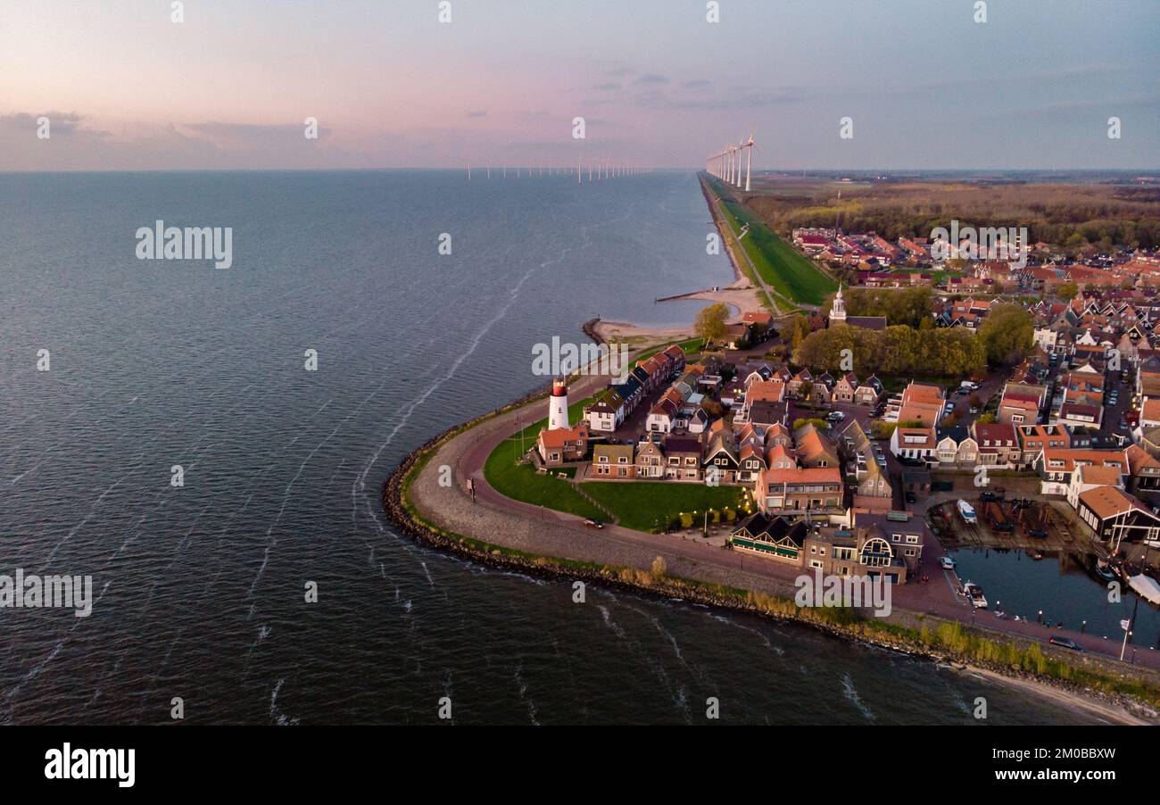 Sunset at the lighthouse and harbor of Urk Holland Netherlands Stock ...