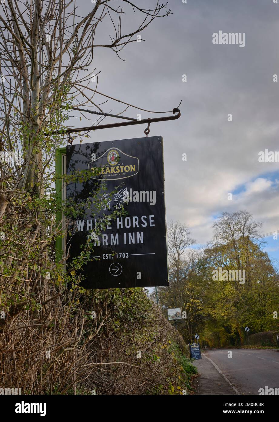 Sign To The Traditional White Horse Farm Inn Nestling In A Tall