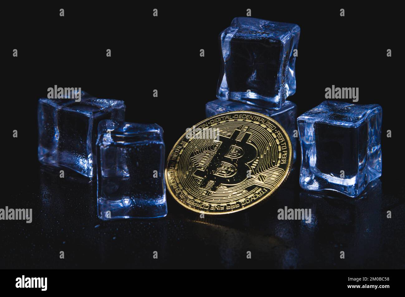 Ice and bitcoin coin. Freezing of cryptocurrency accounts. Frozen ...