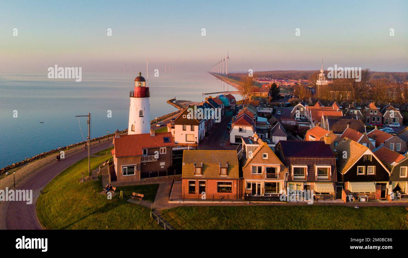 Sunset at the lighthouse and harbor of Urk Holland Netherlands Stock ...