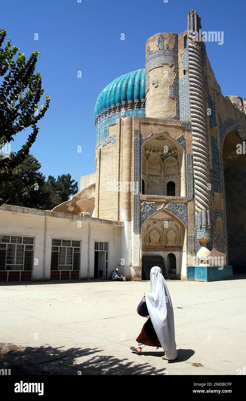 A woman in a white burqa (burka) at the Shrine of Khwaja Abu Nasr Parsa ...