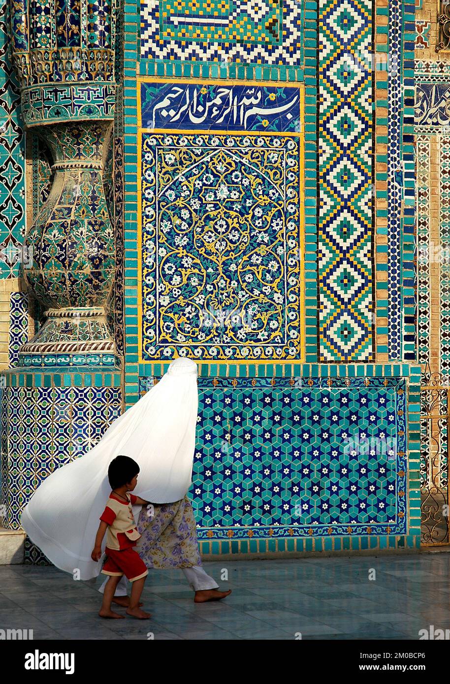Mazar-i-Sharif, Balkh Province / Afghanistan: A woman in a white burqa ...