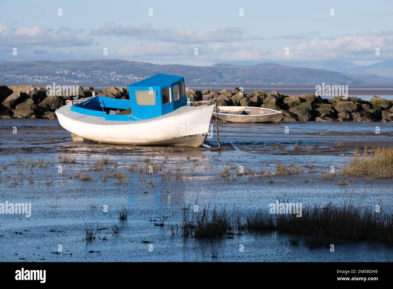 Beached blue boat at low tide on Morecambe Bay Lancashire England Stock ...