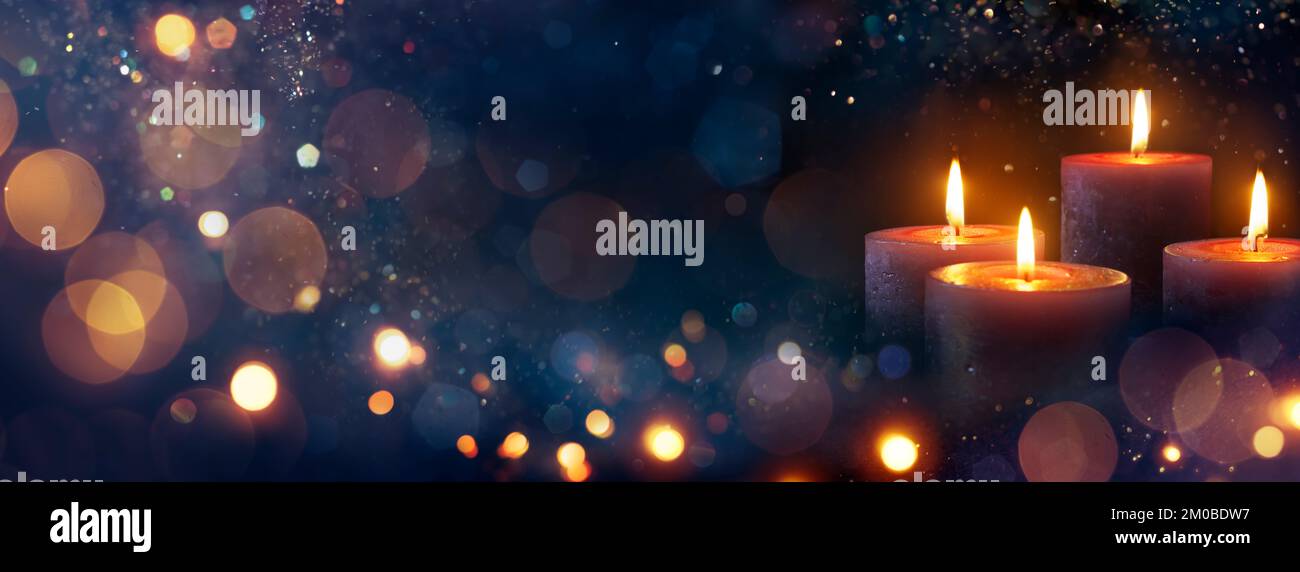 Advent Candles Burning In The Dark With Abstract Defocused Lights Stock ...