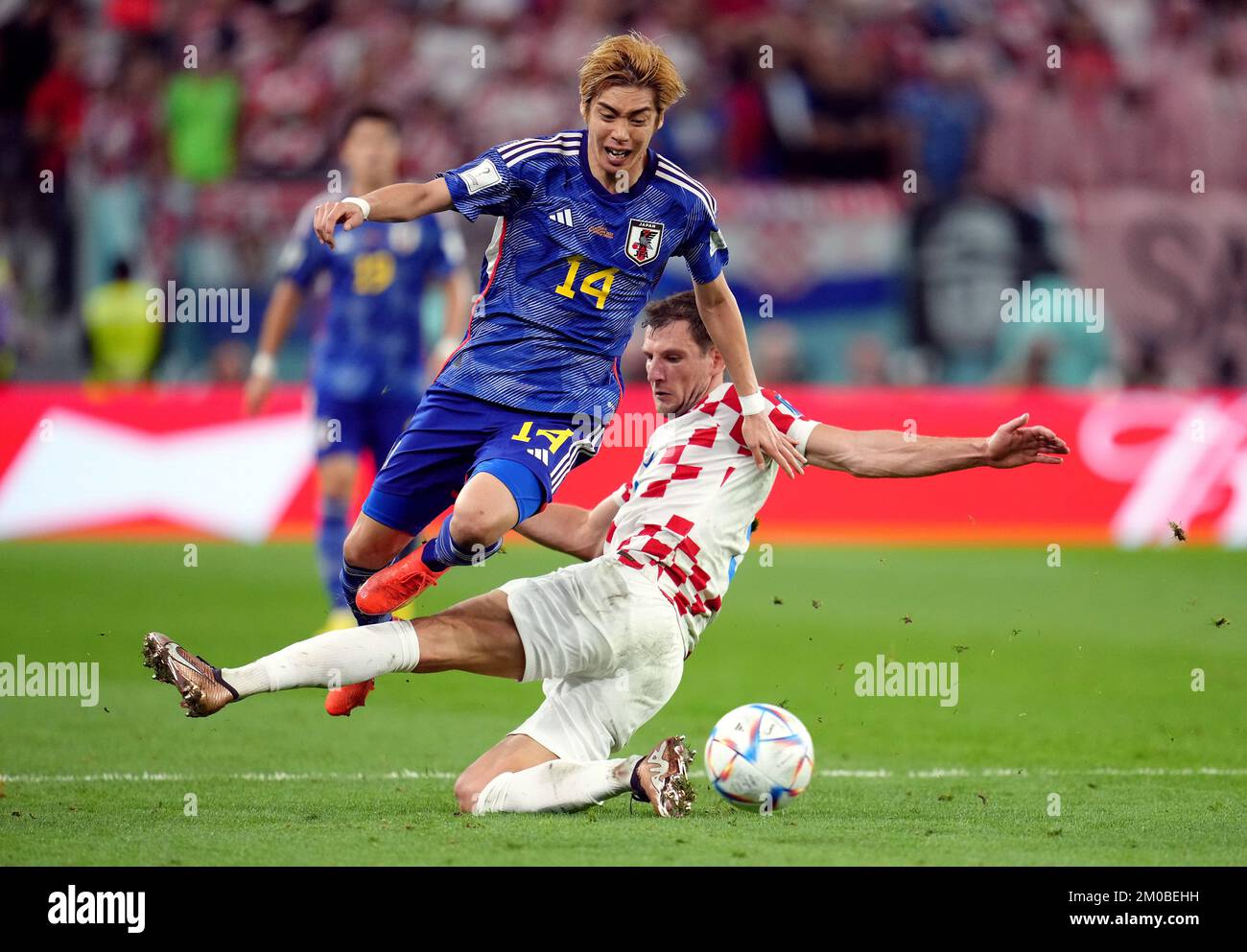 Croatia's Borna Barisic fouls Japan’s Junya Ito during the FIFA World Cup Round of Sixteen match ...