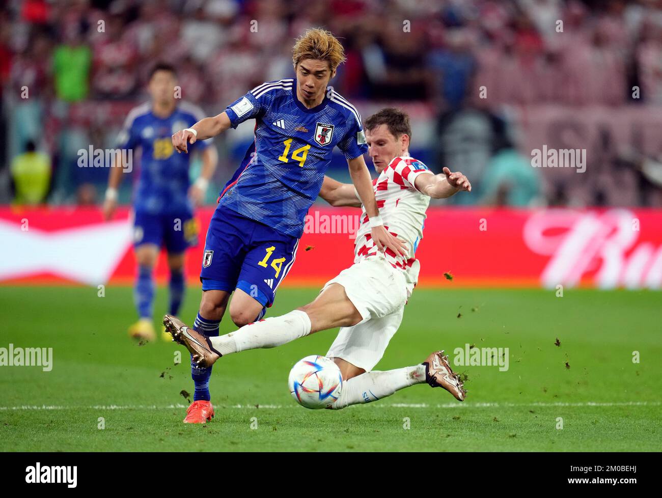 Croatia's Borna Barisic fouls Japan’s Junya Ito during the FIFA World Cup Round of Sixteen match ...
