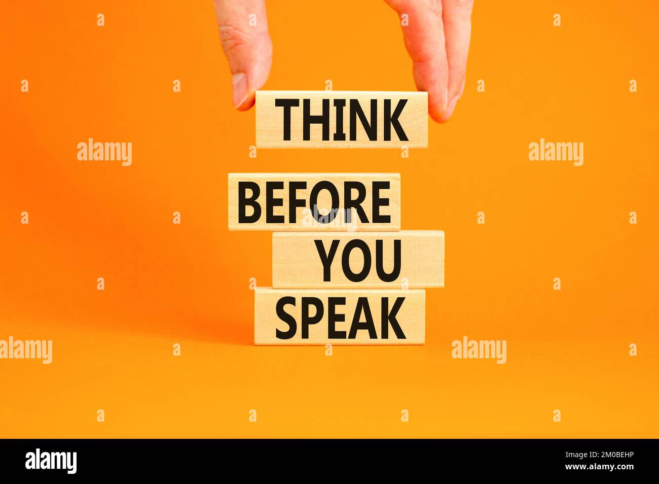 Think before you speak symbol. Concept words Think before you speak on wooden cubes. Beautiful ...