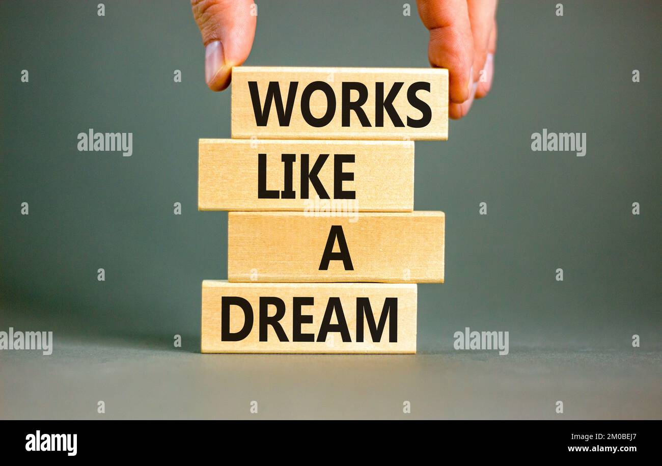 Works like a dream symbol. Concept words Works like a dream on wooden ...