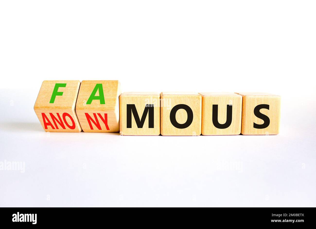 Famous or anonymous symbol. Concept word Famous and Anonymous on wooden ...