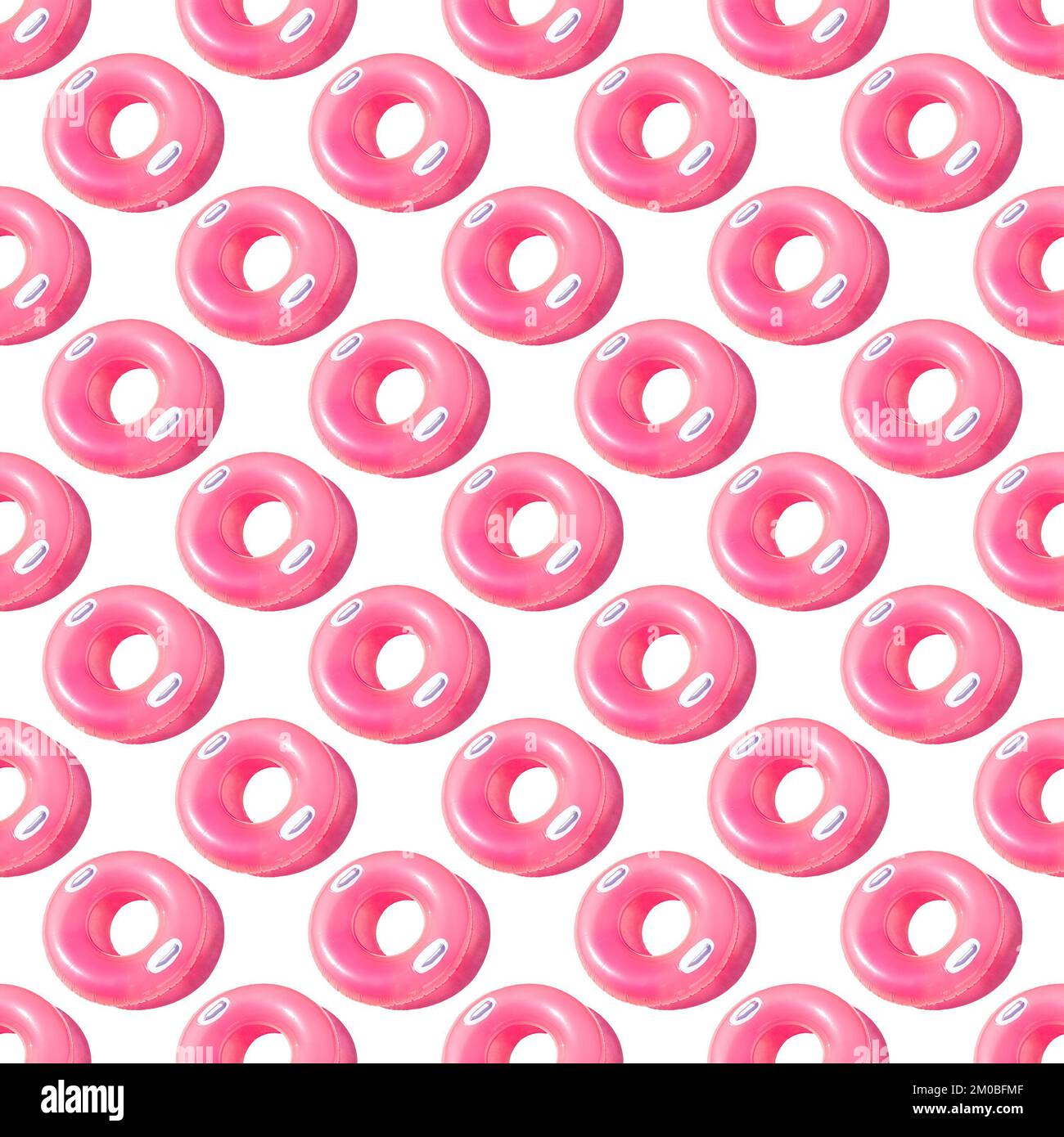 Pattern of bright pink inflatable rubber circles on a pale pink ...