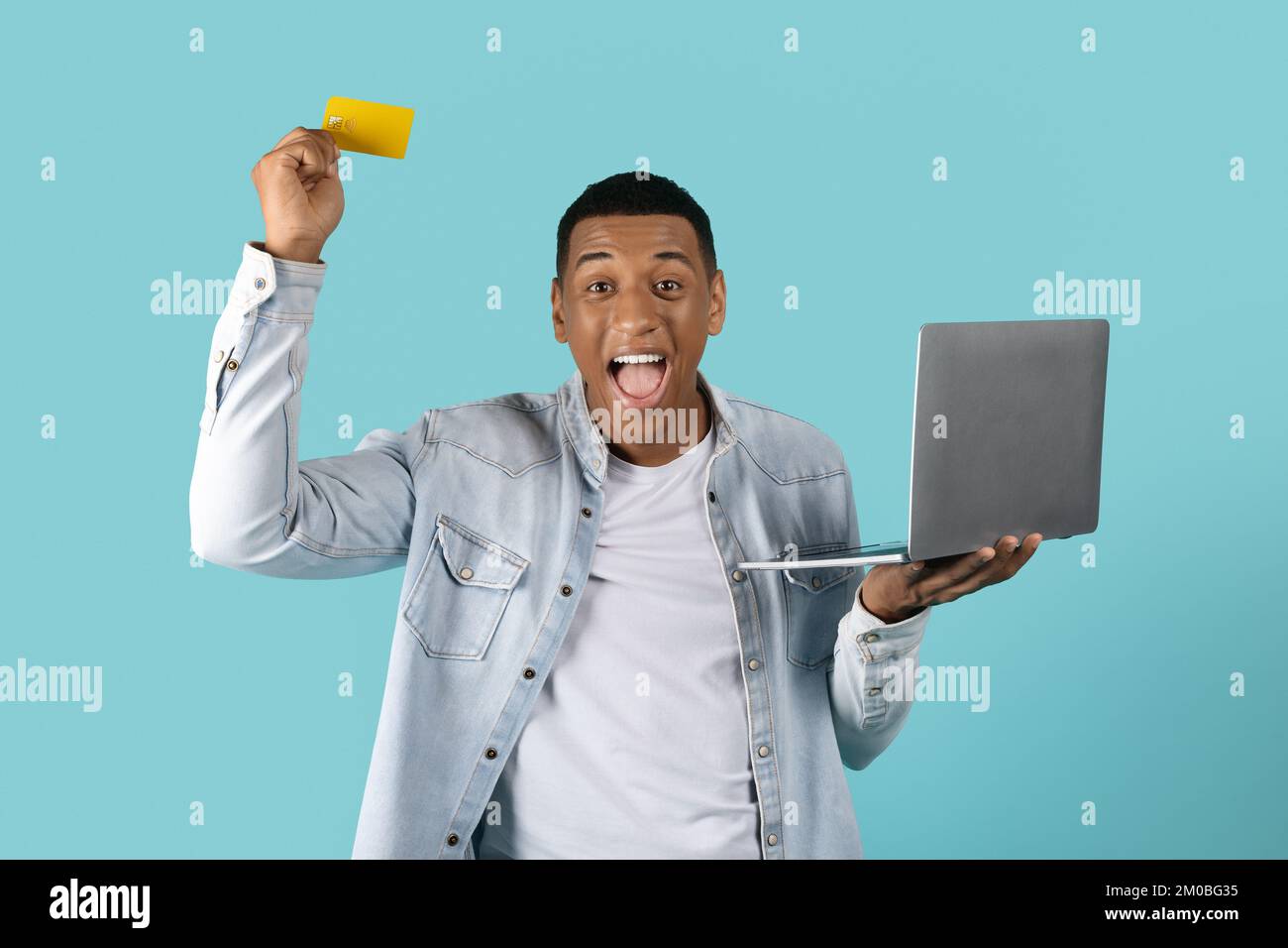 Happy excited young african american man in casual with open mouth with ...