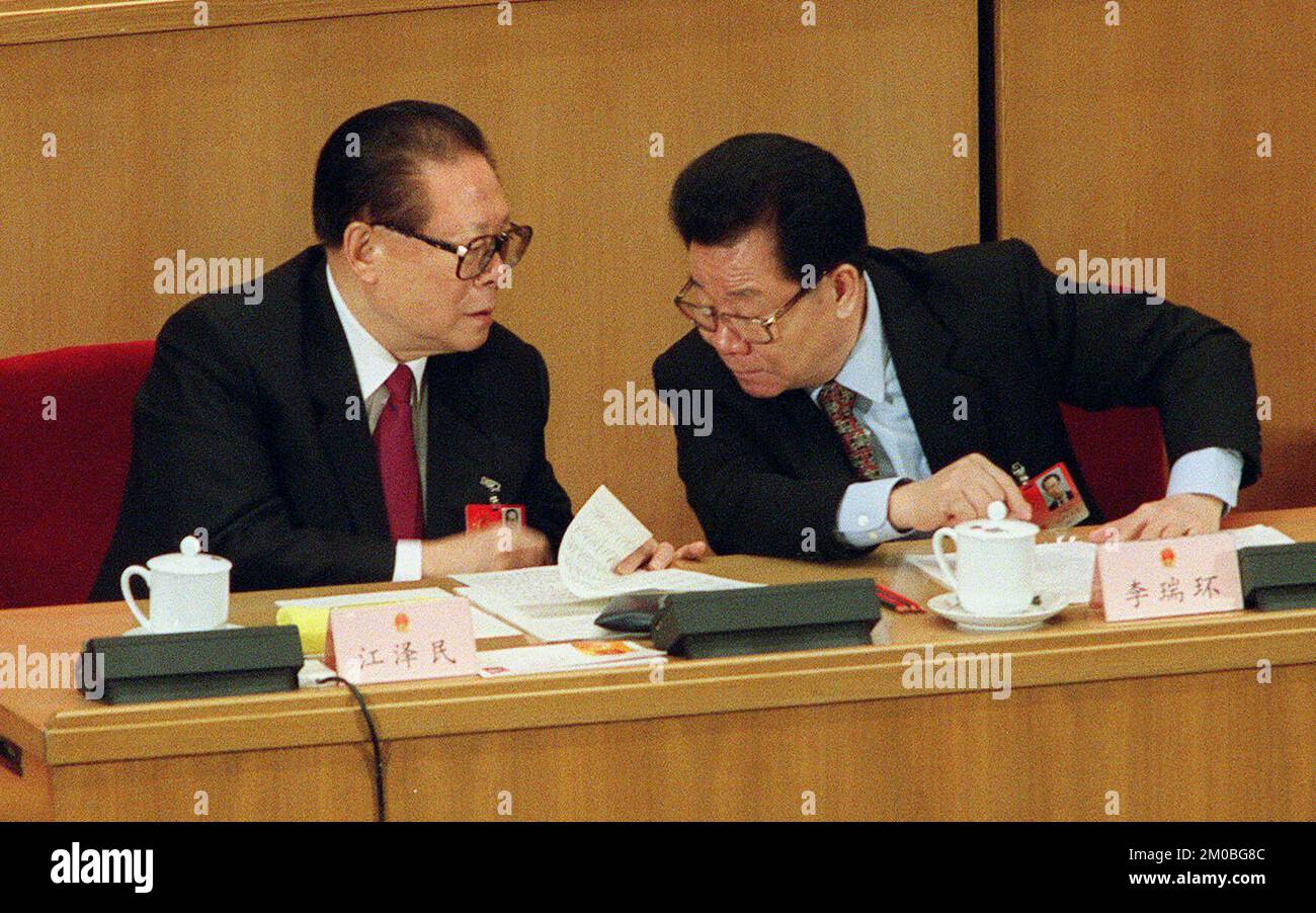 The Chinese President Jiang Zemin (L) talks with the NPC Chairman Mr Li ...