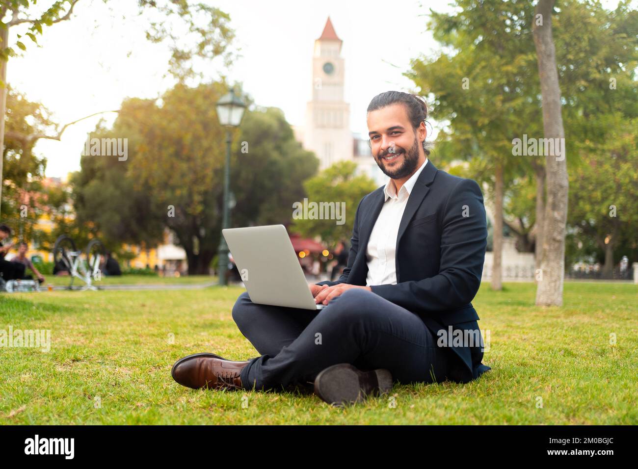 Handsome hispanic male businessman sitting hi-res stock photography and ...