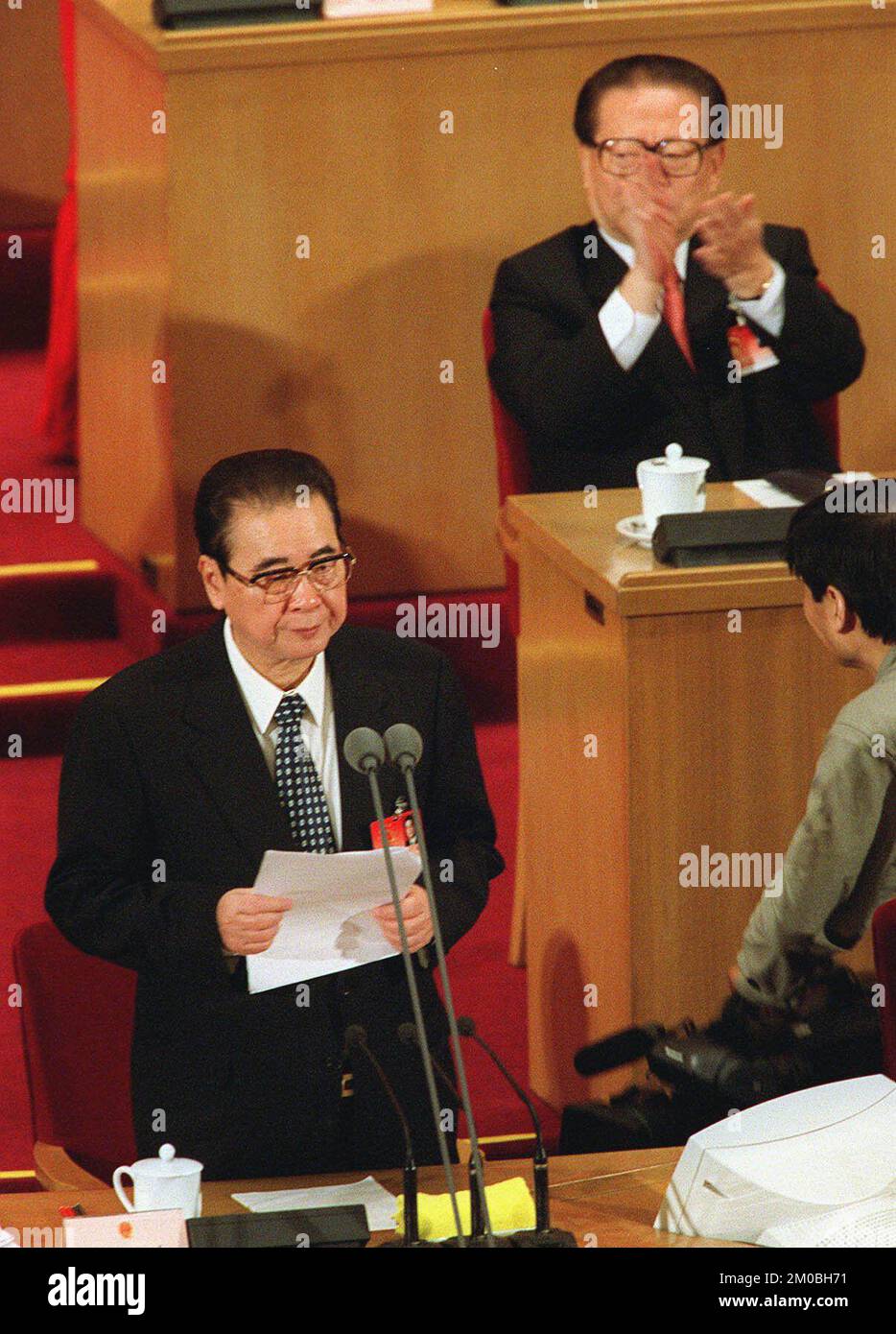 The Chairman of the NPC, Mr Li Peng (front) gives the final address of ...