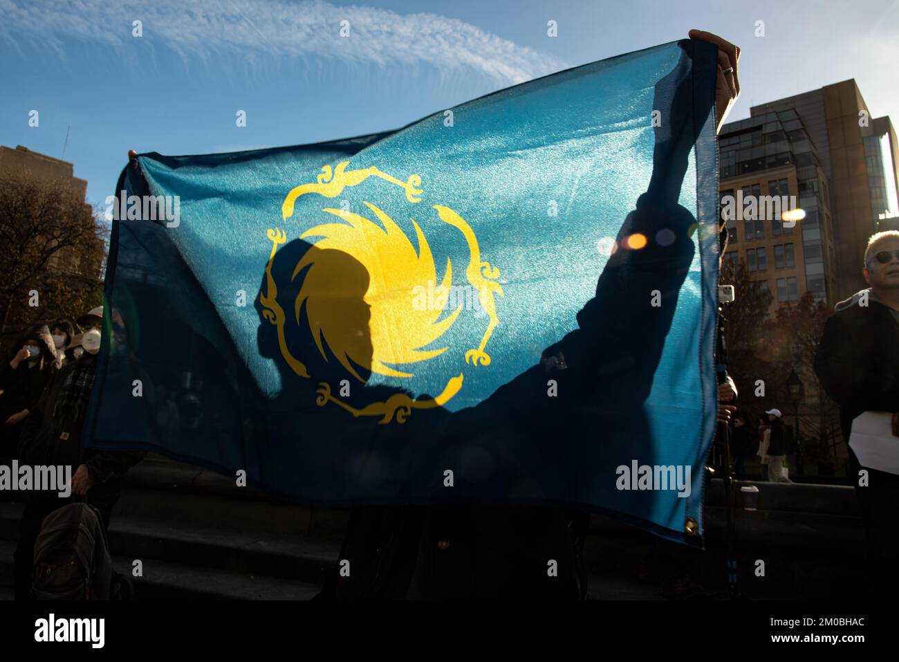 December 4, 2022, New York City, New York, USA: A man holds a flag up ...
