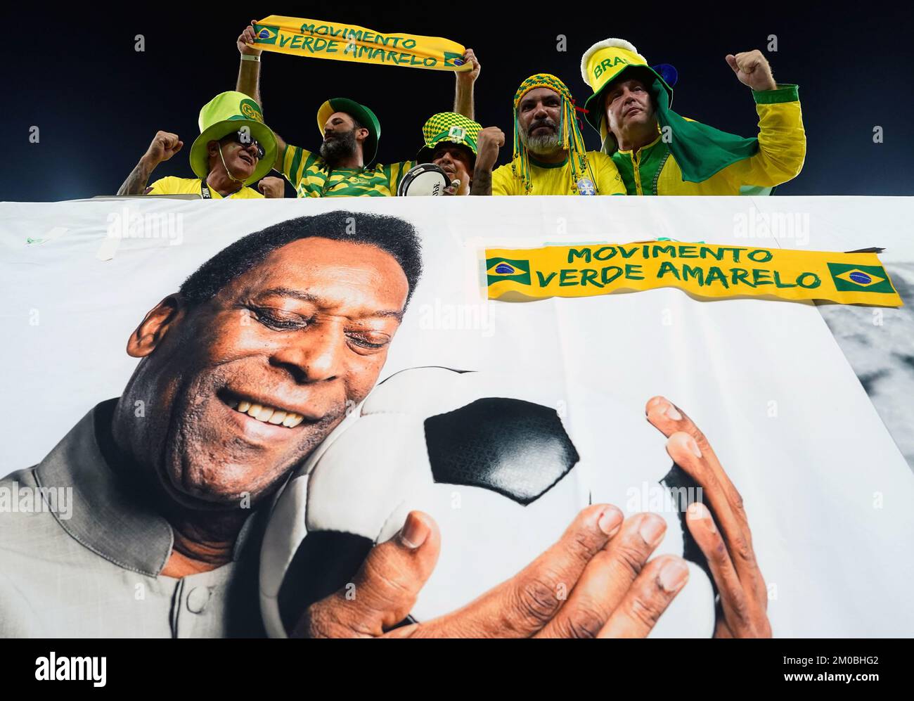 Brazil fans in the stands above a banner featuring former Brazil player ...