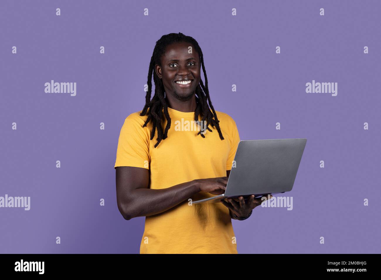 Positive man programmer laptop hi-res stock photography and images - Alamy